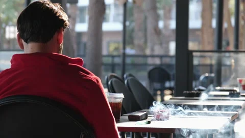Back view of man smoking tobacco cigaret... | Stock Video | Pond5