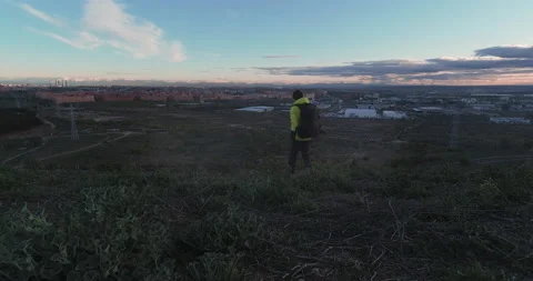 Back view of man with yellow down jacket... | Stock Video | Pond5