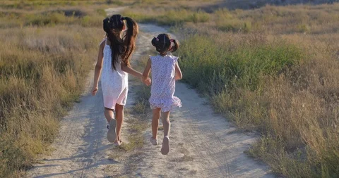 Back view middle plan two beautiful lit... | Stock Video | Pond5