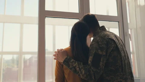 Back view of military man hugging his wi... | Stock Video | Pond5