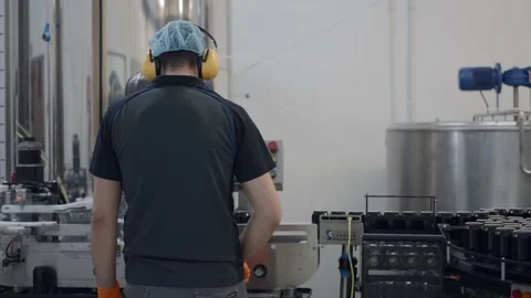 Back View Of An Operator Wearing Hairnet... | Stock Video | Pond5