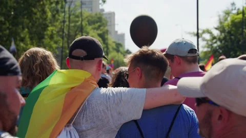 Back view of people with rainbow flags i... | Stock Video | Pond5