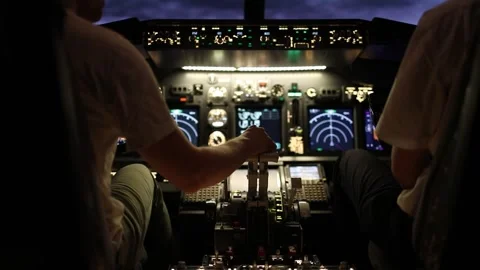 Back view of the pilots in the cockpit. ... | Stock Video | Pond5