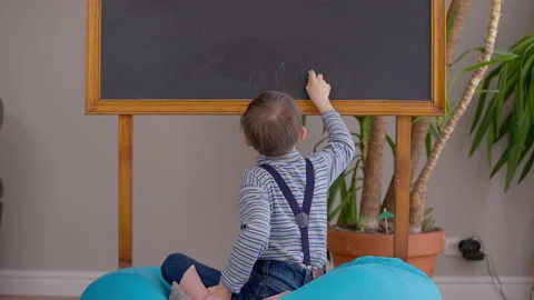 Back view portrait of autistic cheerful ... | Stock Video | Pond5