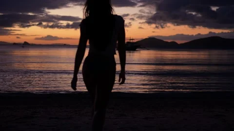 Back view of silhouette woman on a tropi... | Stock Video | Pond5