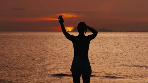 Back view silhouette of young woman look... | Stock Video | Pond5