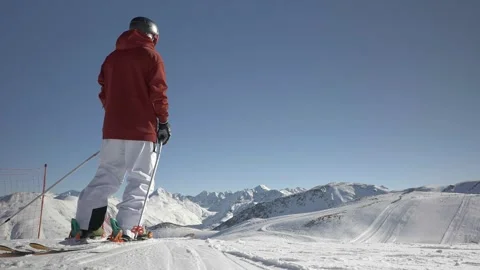 Back View of Skier on Top of Hill Lookin... | Stock Video | Pond5