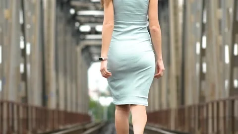 Back view of a slim woman with long hair... | Stock Video | Pond5