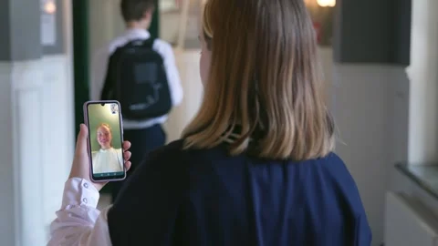 Back view of teen girl having video call... | Stock Video | Pond5