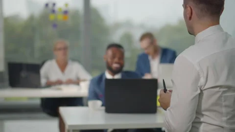 Back view of top manager presenting new ... | Stock Video | Pond5
