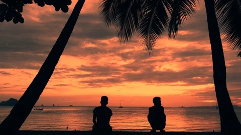 Back view of two boys silhouettes sittin... | Stock Video | Pond5