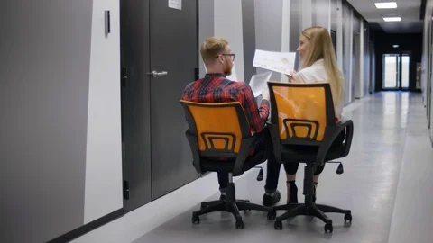 Back view of two office employees riding... | Stock Video | Pond5