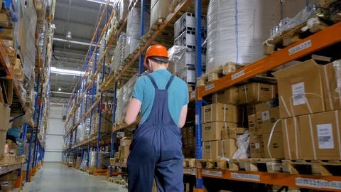 A back view on a walking warehouse inven... | Stock Video | Pond5