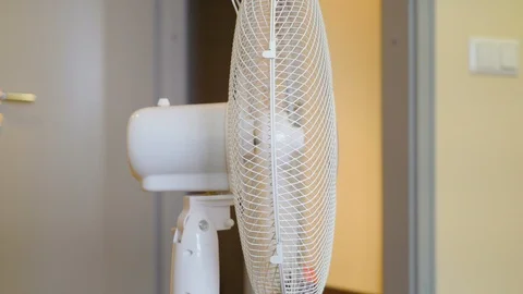 The back view of the white stand fan | Stock Video | Pond5