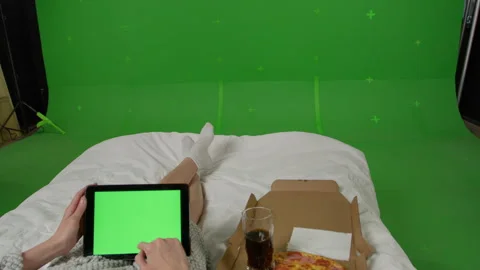 Back view of Woman sitting on bed and ea... | Stock Video | Pond5