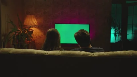 Back view young couple sitting on the co... | Stock Video | Pond5