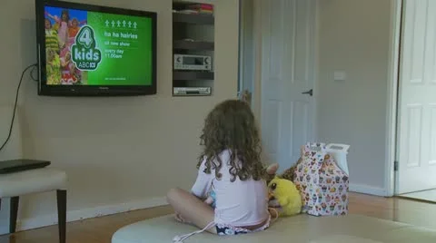 Back view of young girl watching TV (2) ... | Stock Video | Pond5