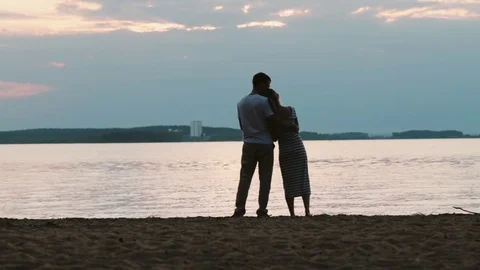 Back view of young happy couple standing... | Stock Video | Pond5