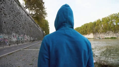 Back view of a young hooded black man wa... | Stock Video | Pond5