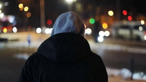 back view young man hood walking night s... | Stock Video | Pond5