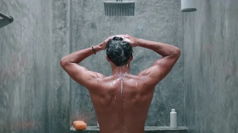 Back view Young Man Washing and Taking a... | Stock Video | Pond5