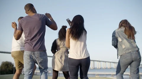 Back view of young people dancing in par... | Stock Video | Pond5