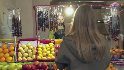 Back view of young woman gives a paper b... | Stock Video | Pond5