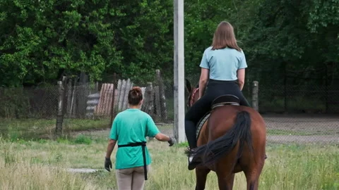 Back View Young Woman Riding Horse in Co... | Stock Video | Pond5