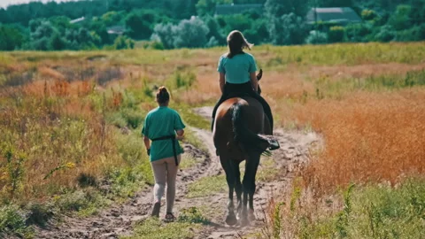 Back View Young Woman Riding Horse in Co... | Stock Video | Pond5