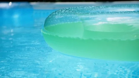 Background of floats in swimming pool | Stock Video | Pond5