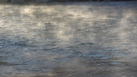 Backlit flowing river with steam evapora... | Stock Video | Pond5