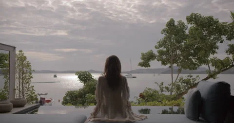 Backshot of woman sitting in front of sw... | Stock Video | Pond5