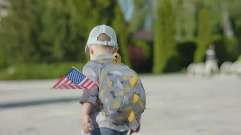 backside view baby boy in blue cap, grey... | Stock Video | Pond5