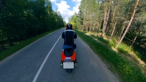 Backside view of the motorcycle riding o... | Stock Video | Pond5