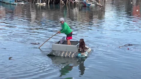 Badjao woman using a floating raft with ... | Stock Video | Pond5