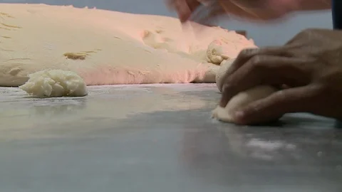 A Baker Dividing And Preparing Round Bal... | Stock Video | Pond5