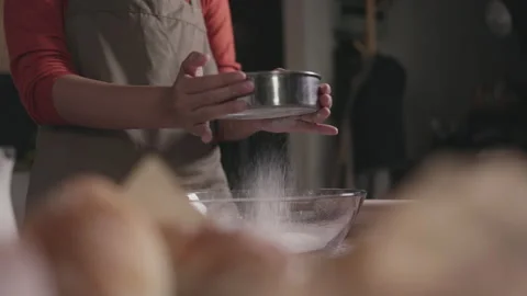 baker sift flour with sifter on kitchen ... | Stock Video | Pond5