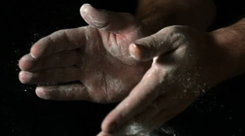 Bakers hands clapping flour off on black... | Stock Video | Pond5