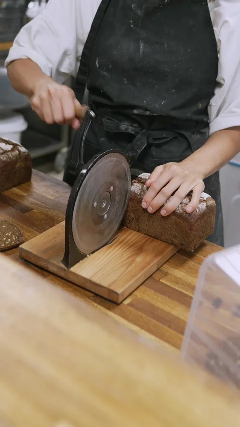 The bakery's bread cutting process. | Stock Video | Pond5