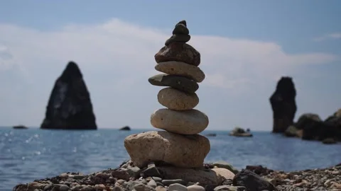 Balanced rock pyramid on pebbles beach, ... | Stock Video | Pond5