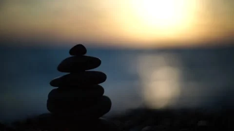 Balanced rock pyramid on pebbles beach. ... | Stock Video | Pond5