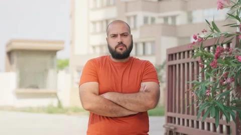 Bald indian Man with Folded Arms Looking... | Stock Video | Pond5