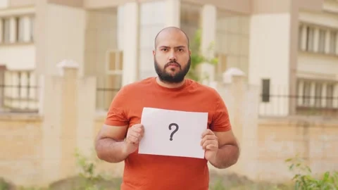 Bald indian Man Holding Question Mark Po... | Stock Video | Pond5