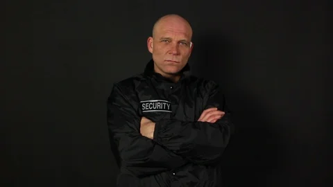 Bald Security Guard / Bouncer wearing bl... | Stock Video | Pond5