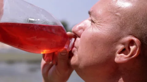 Bald Wrinkly Man Greedily Drinks Juice, ... | Stock Video | Pond5