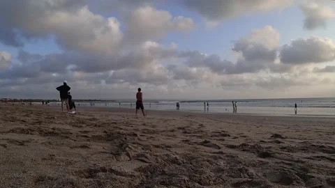 Bali beachfront at sunset low clouds wit... | Stock Video | Pond5