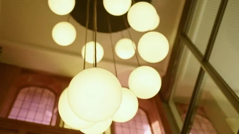Ball Pendant Ceiling Lights Hanging In A... | Stock Video | Pond5