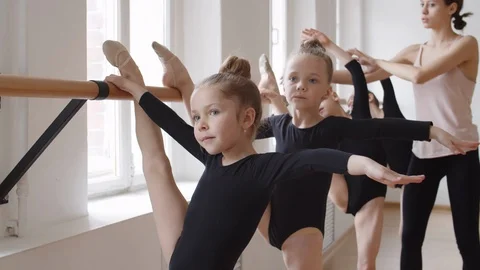 Ballet Coach Teaching Four Little Girls | Stock Video | Pond5