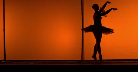Ballet dancing girl in orange background | Stock Video | Pond5