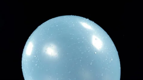Balloon popping on black background | Stock Video | Pond5